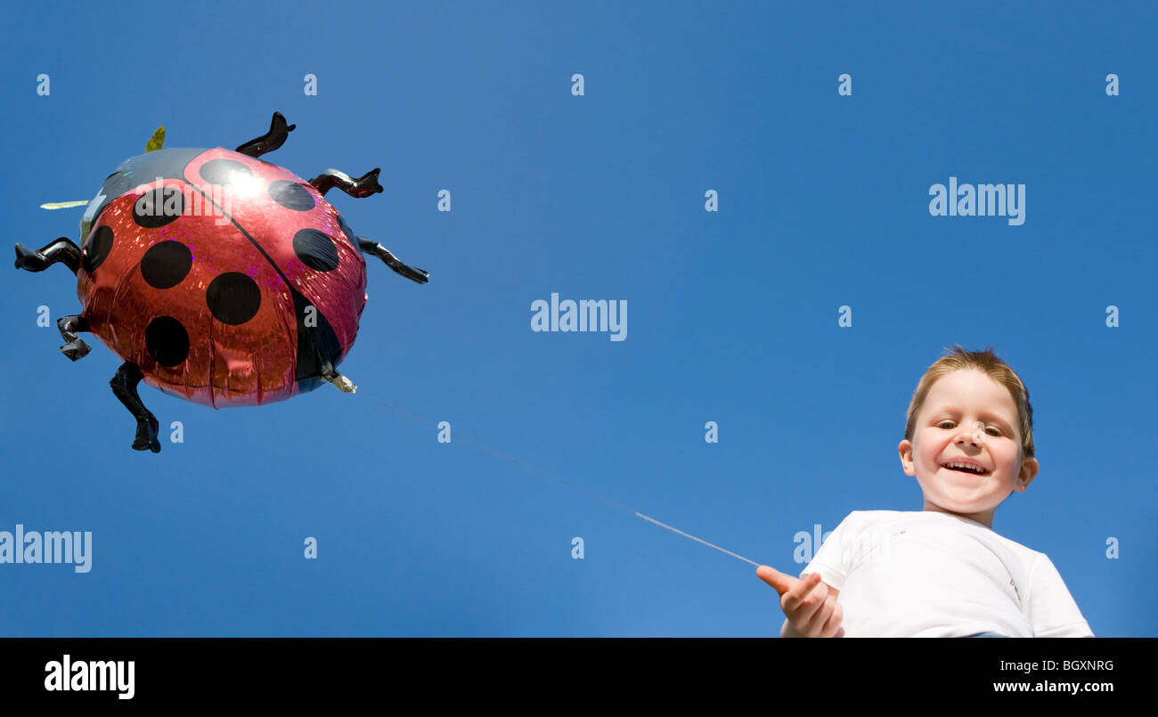 Little boy and balloon Stock Photo - Alamy