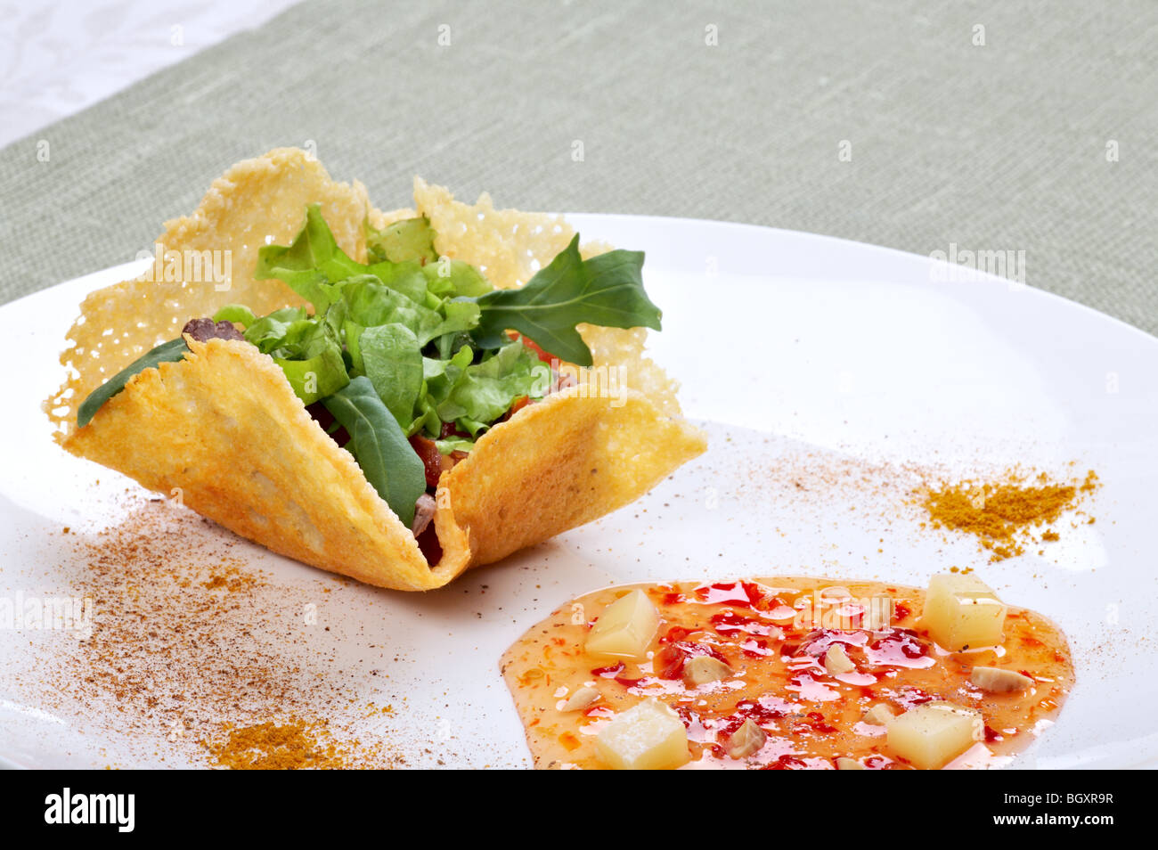 Fresh light salad in parmesan cheese basket Stock Photo - Alamy