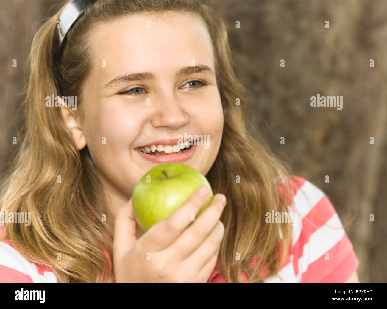 Girl eating apple Stock Photo - Alamy