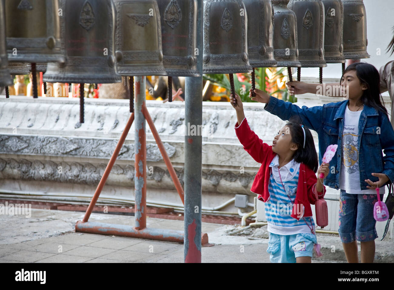 Thai girls ringing the bells. Wat Phanan Choeng. Ayutthaya. Thailand ...