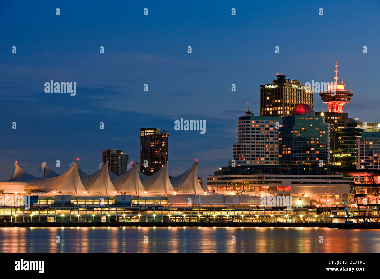 Canada Place and high-rise buildings in the city of Vancouver at dusk ...