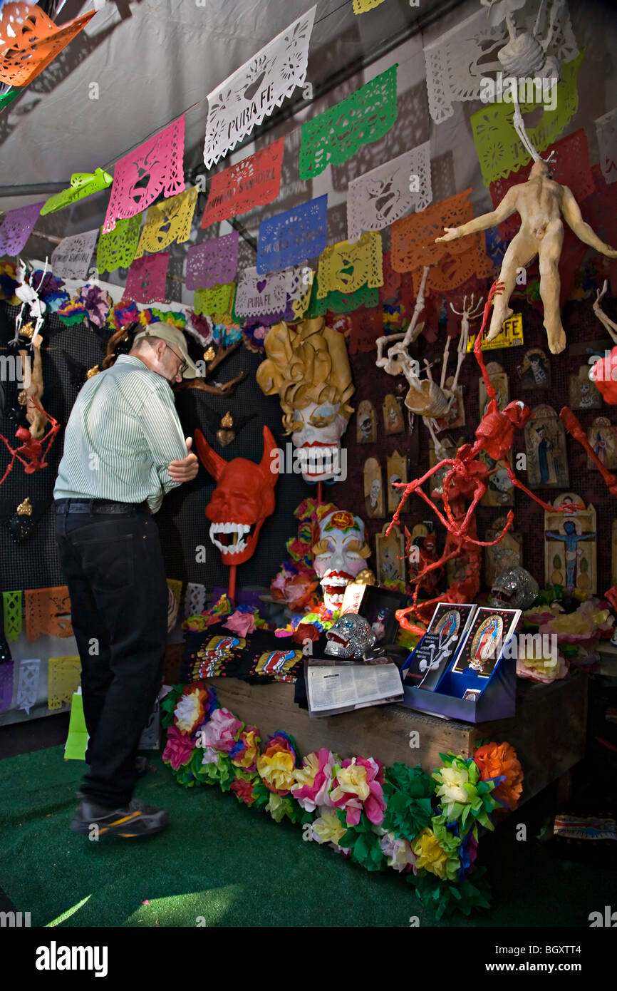 Tourist in artist Raymond Sandoval's booth at the Contemporary Hispanic ...