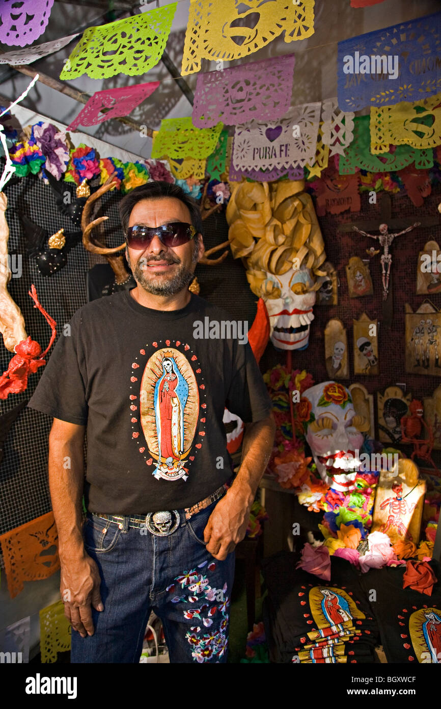 Artist Raymond Sandoval in his booth at the Contemporary Hispanic ...