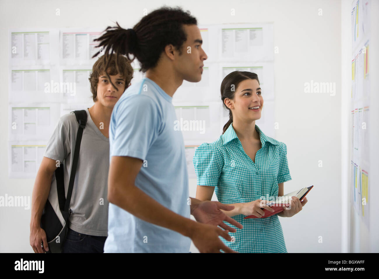 Male college student staring with disbelief at results posted on ...