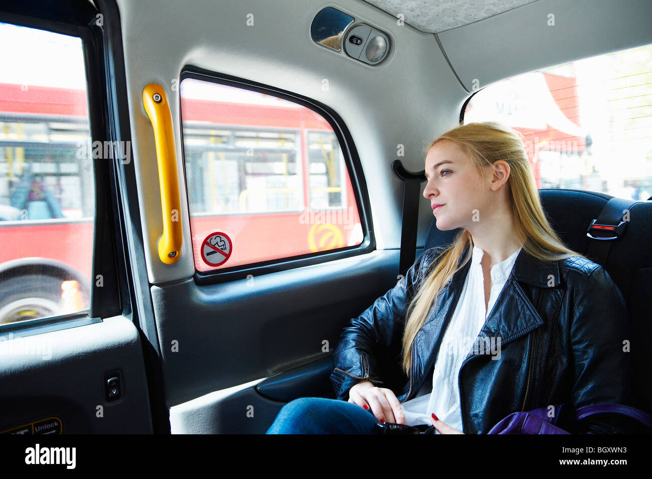 Woman in taxi Stock Photo - Alamy