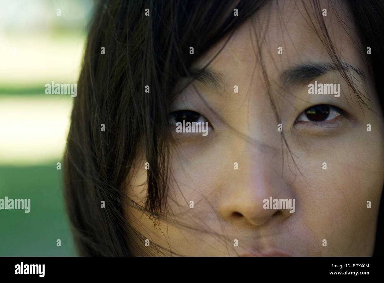 Young woman looking at camera, close-up of face Stock Photo - Alamy