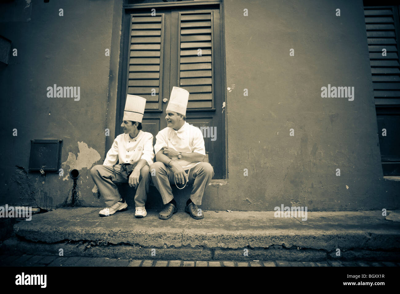 Two cooks taking a break outdoors Stock Photo - Alamy