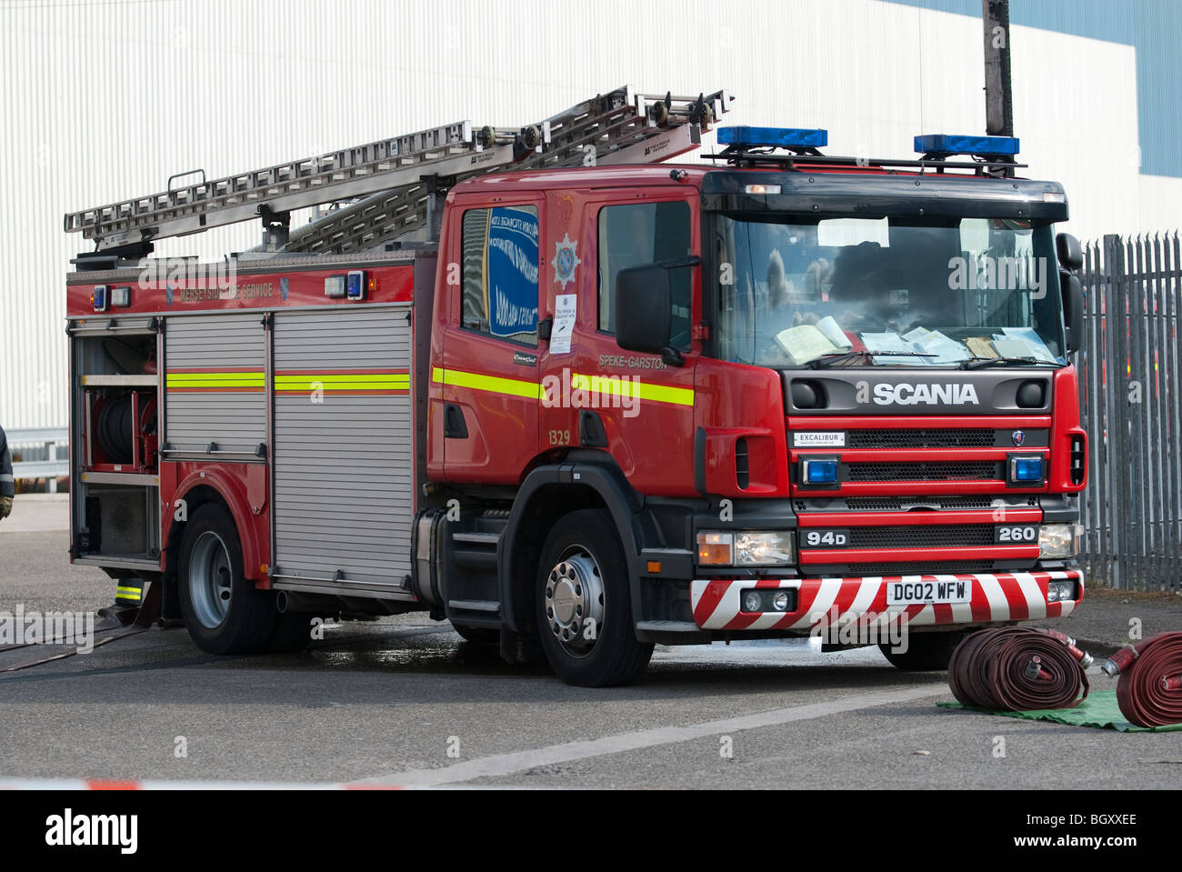 Fire Engine at fire with hose rolled out Stock Photo - Alamy