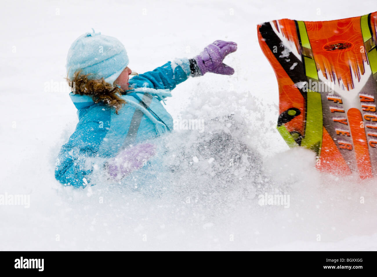 Child sledding in a fresh snowfall Stock Photo - Alamy