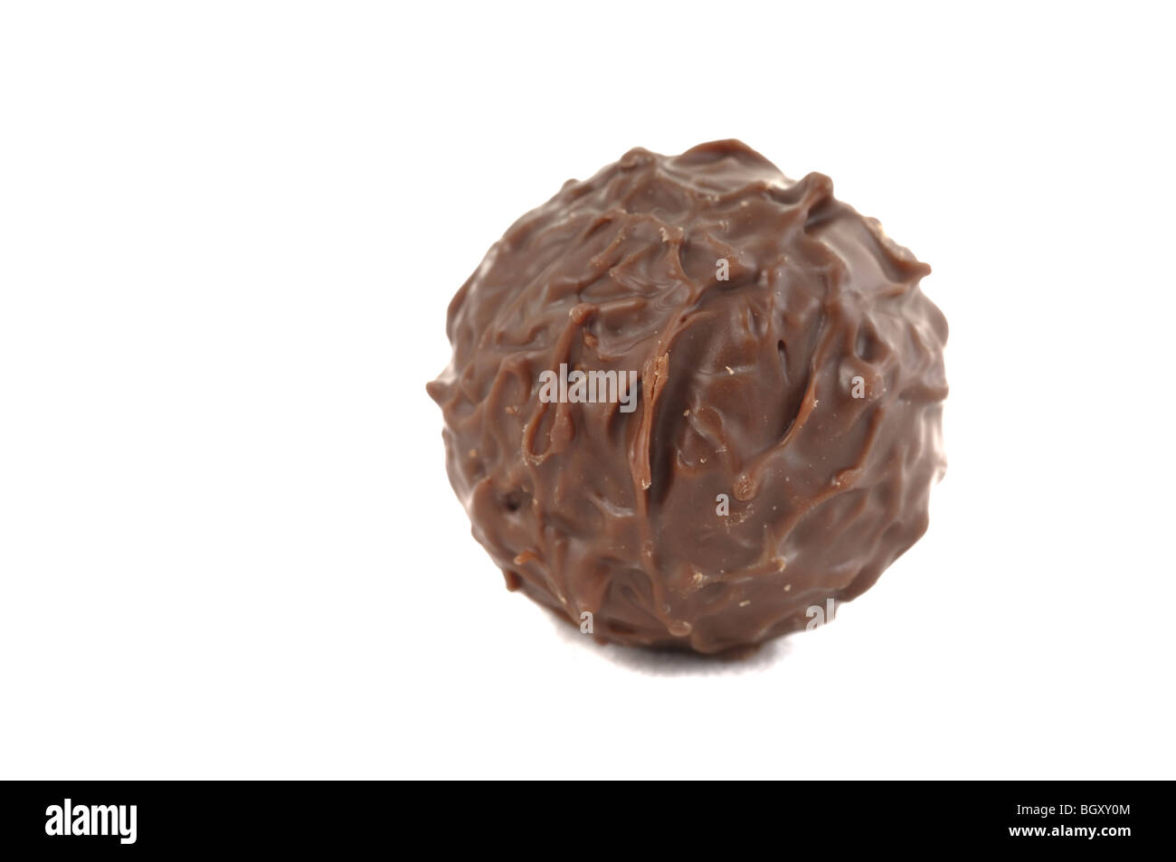 Closeup of a chocolate ball isolated on white background Stock Photo ...