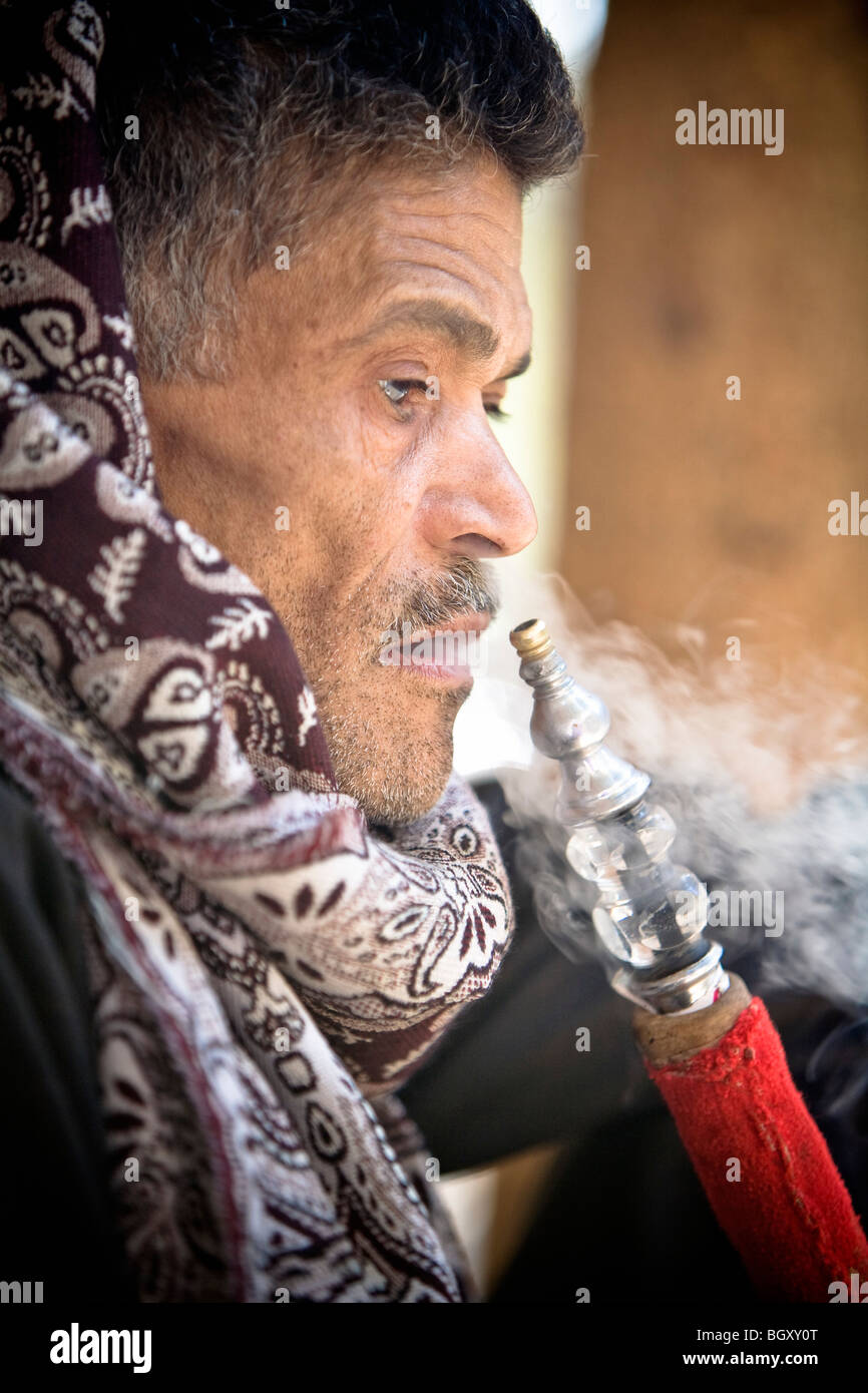 Man smoking a hooka pipe Stock Photo - Alamy