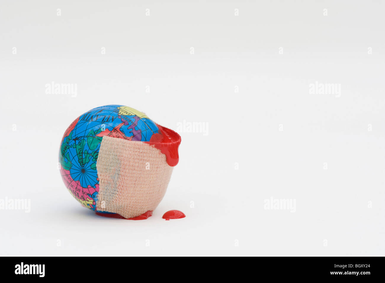 Adhesive bandage dripping blood wrapped around globe Stock Photo - Alamy