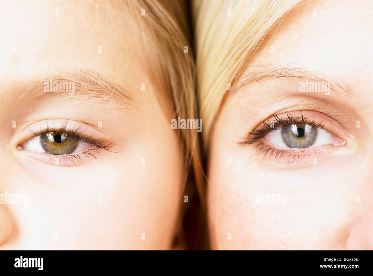 Mother and daughter looking at camera Stock Photo - Alamy