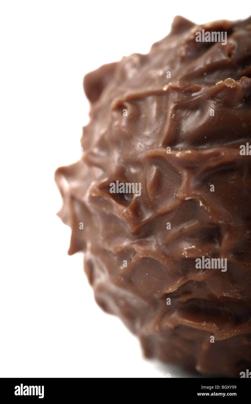 Closeup of a chocolate ball isolated on white background Stock Photo ...