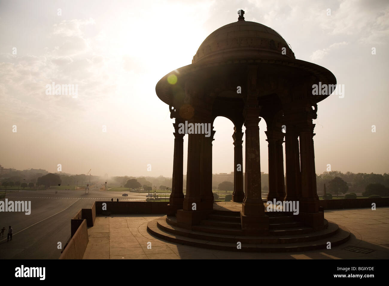 The sun shines down onto a chhattri in front of the Herbert Baker ...