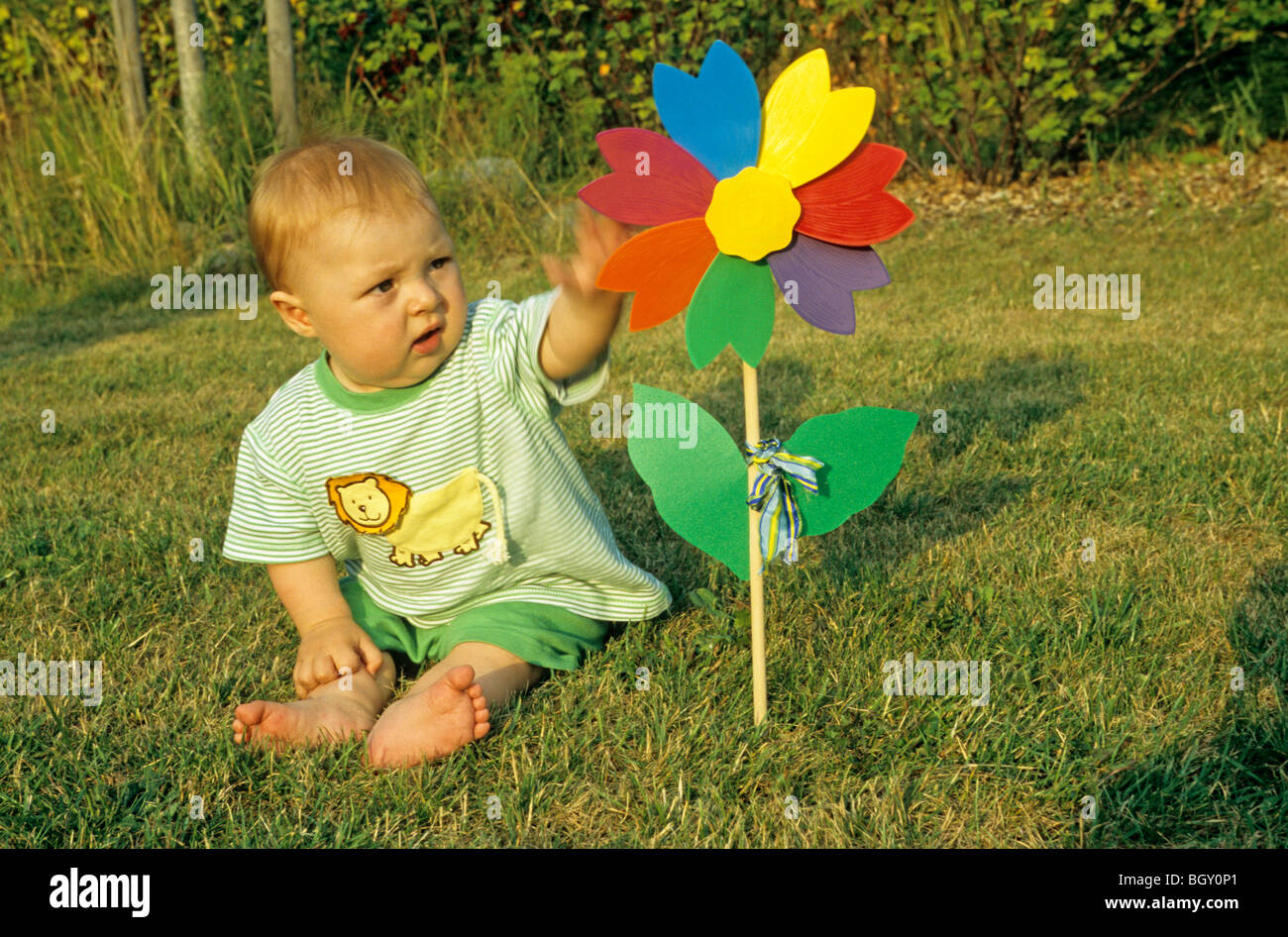 Child with windmill hi-res stock photography and images - Alamy