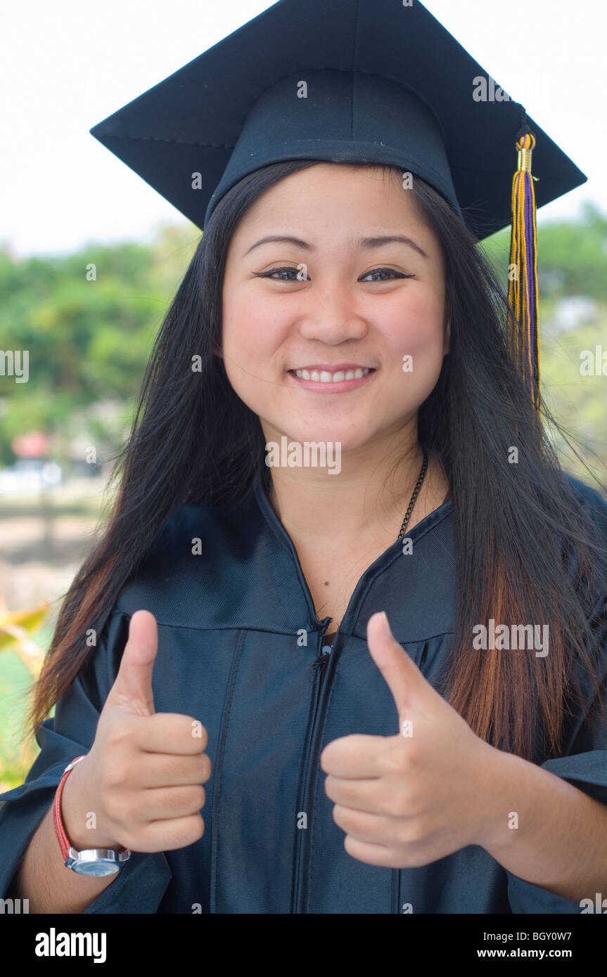 Female graduate in cap and gown Stock Photo - Alamy
