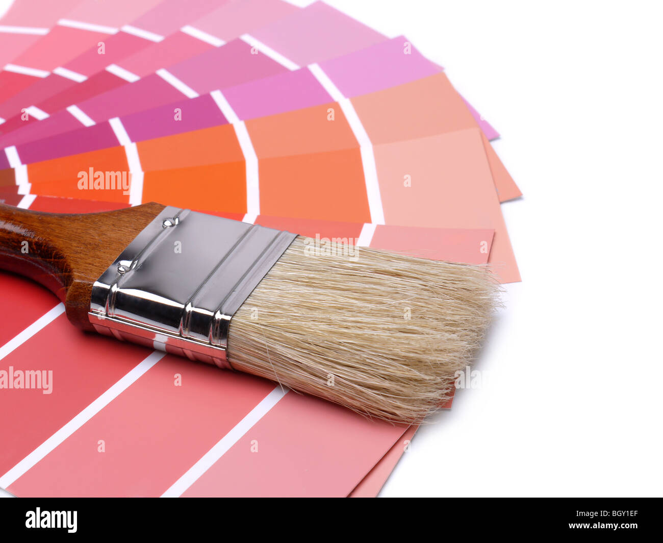 Paint brush on array of paint color swatches Stock Photo - Alamy