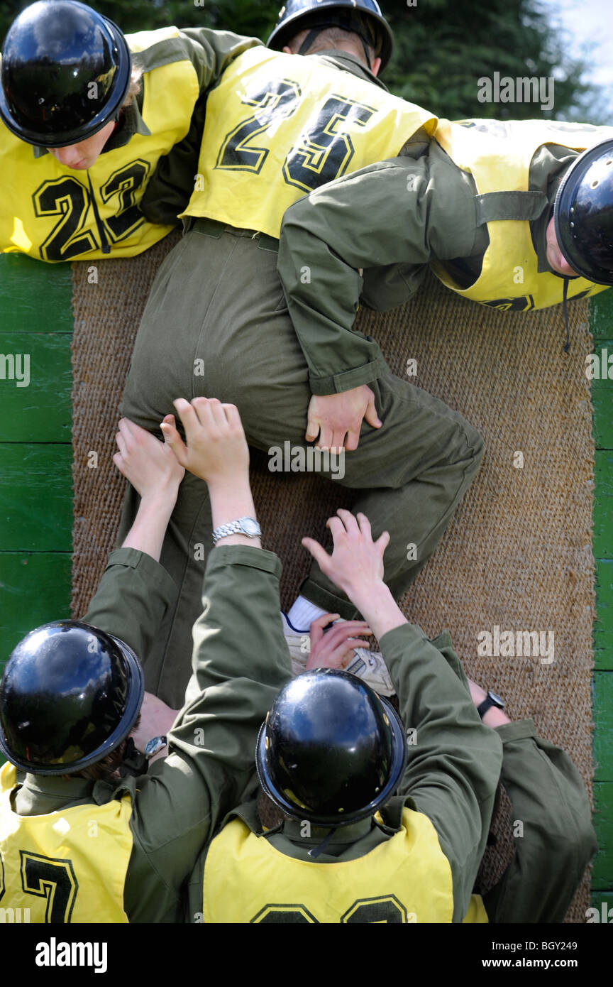 Sixteen year old boys tackle the wall during physical problem solving ...