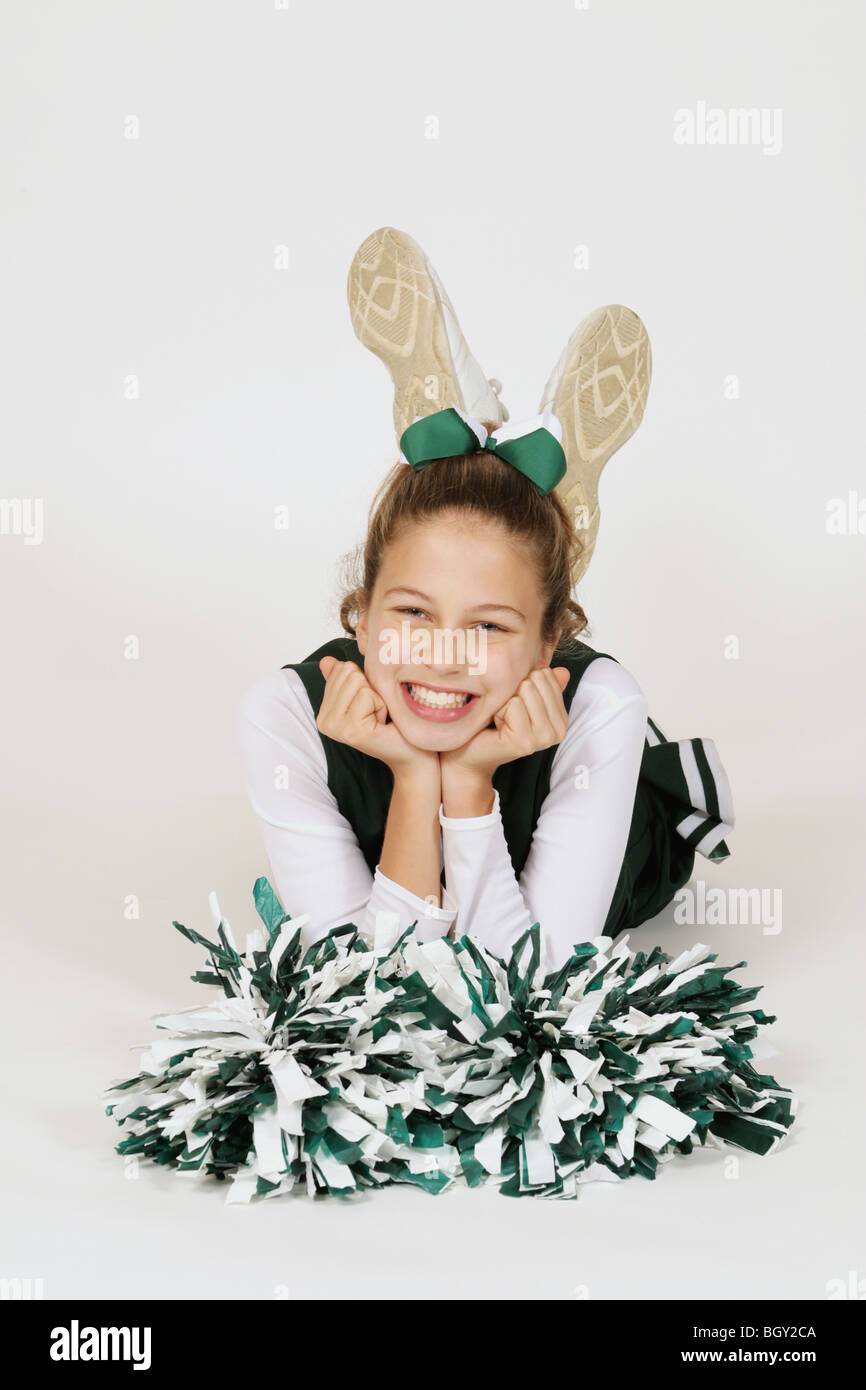 Caucasian girl in Cheerleading poses Stock Photo - Alamy