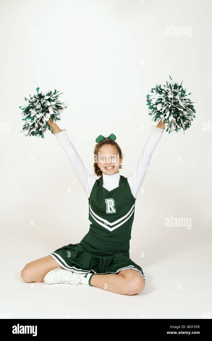 Caucasian girl in Cheerleading poses Stock Photo - Alamy