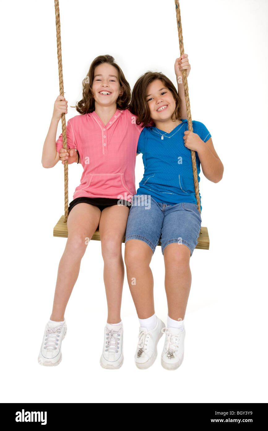 Sisters on a swing hi-res stock photography and images - Alamy