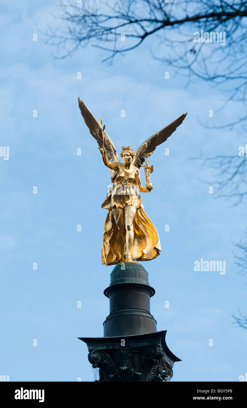 Golden Angel with Tree Stock Photo - Alamy