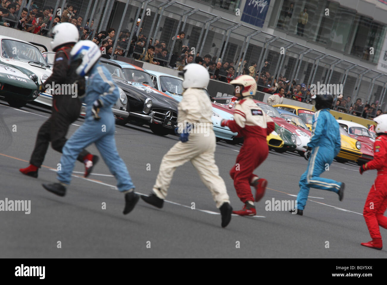 Cars take off from a Le Mans style start. Le Mans Classic car race ...