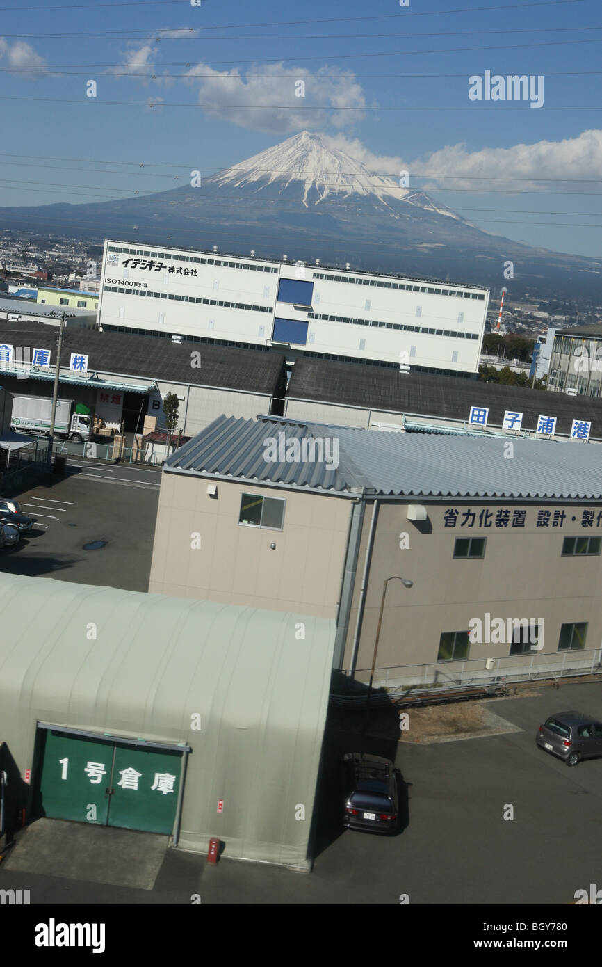 Mount Fuji, seen behind a backdrop of agricultural and industrial ...