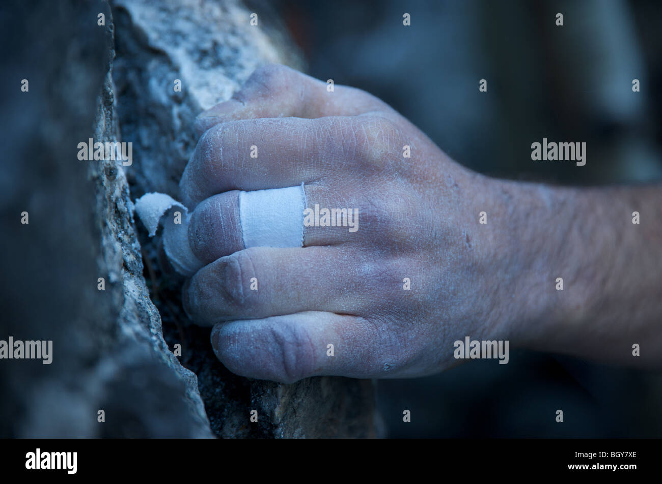 A climber grabs hold of some good ol' granite Stock Photo - Alamy