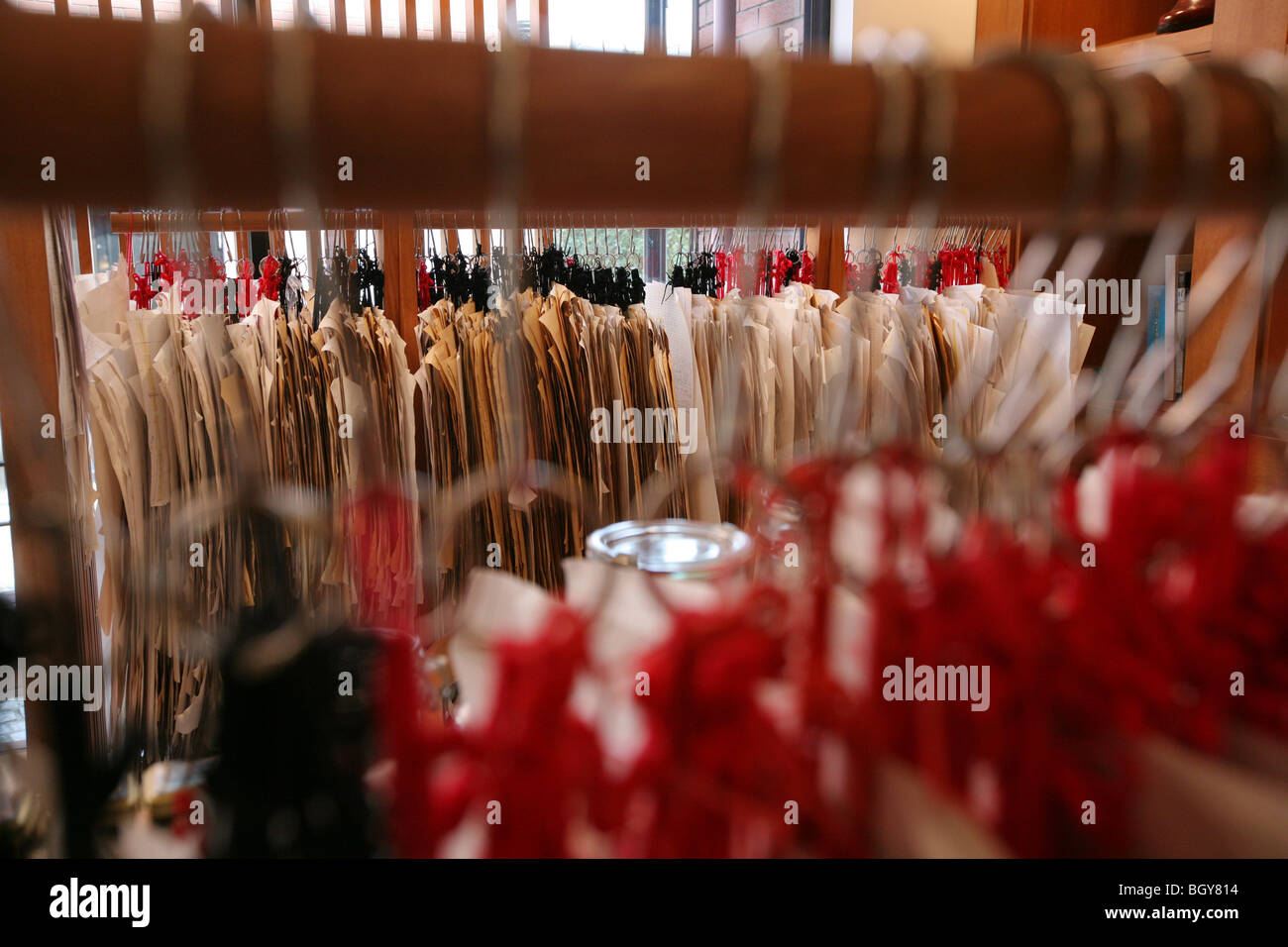 Clothes hanging waiting to be measured on a customer in a tailor ...