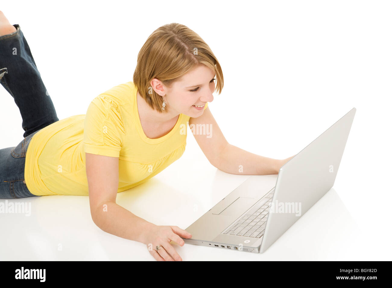 Caucasian teenager working on laptop computer Stock Photo - Alamy