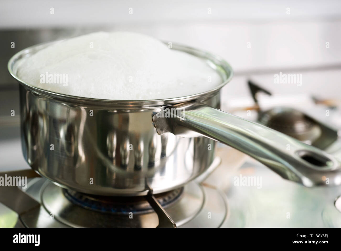 Pot cooking on stove Stock Photo - Alamy