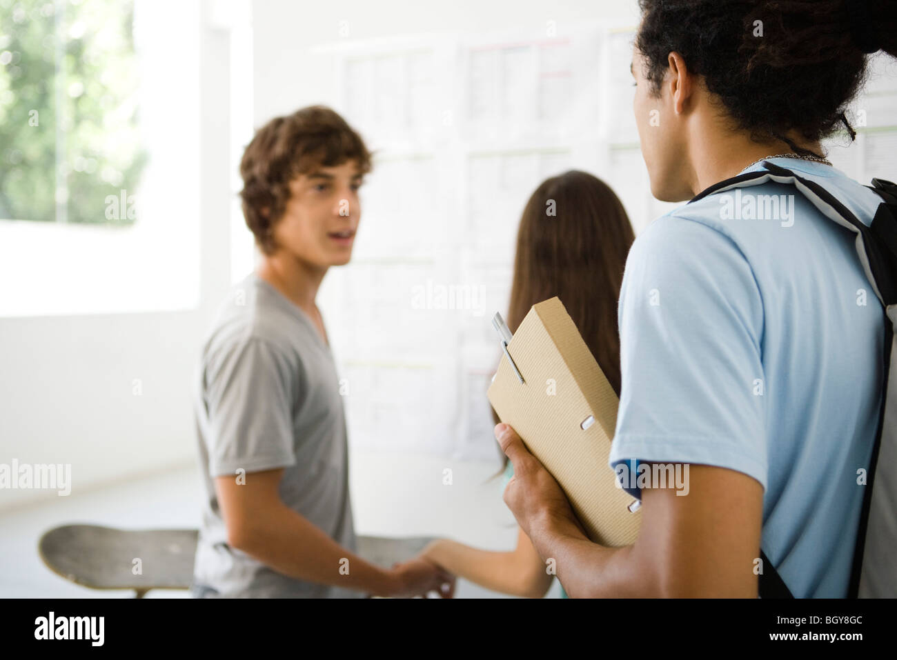 College students talking together Stock Photo - Alamy