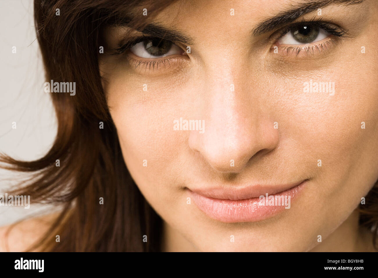 Young woman looking provocatively at the camera, portrait Stock Photo ...