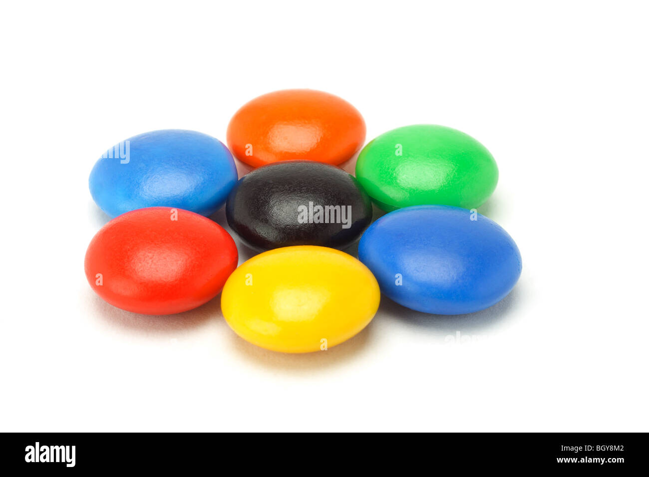Colorful chocolate button candies on white background Stock Photo - Alamy