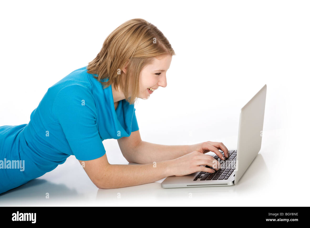 Caucasian teenager working on laptop computer Stock Photo - Alamy