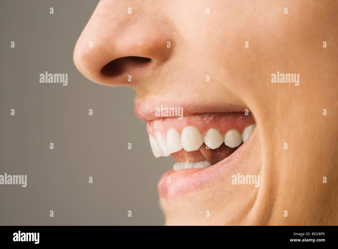 Woman laughing, side view Stock Photo - Alamy