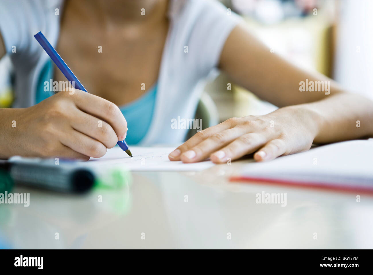 Student busy with classwork Stock Photo - Alamy