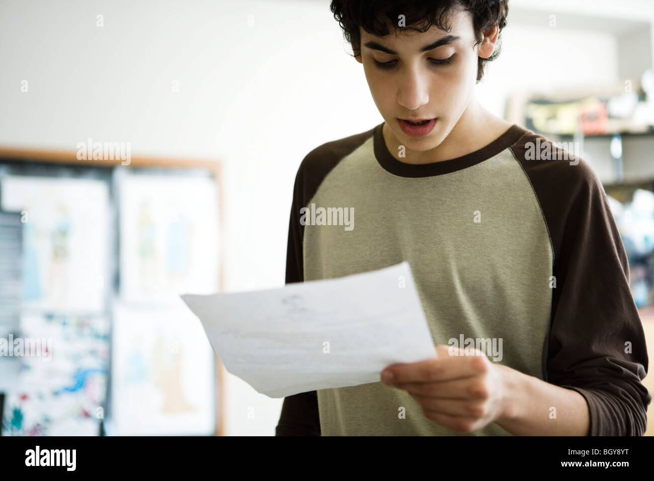 High school student reading report aloud in class Stock Photo - Alamy