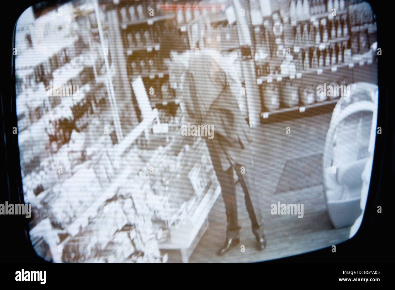 Customer browsing in convenience store, image captured by surveillance ...