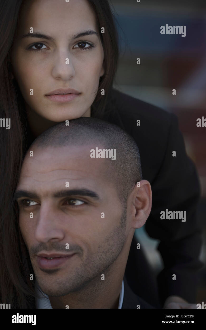 Couple, woman resting chin on top of man's head Stock Photo - Alamy