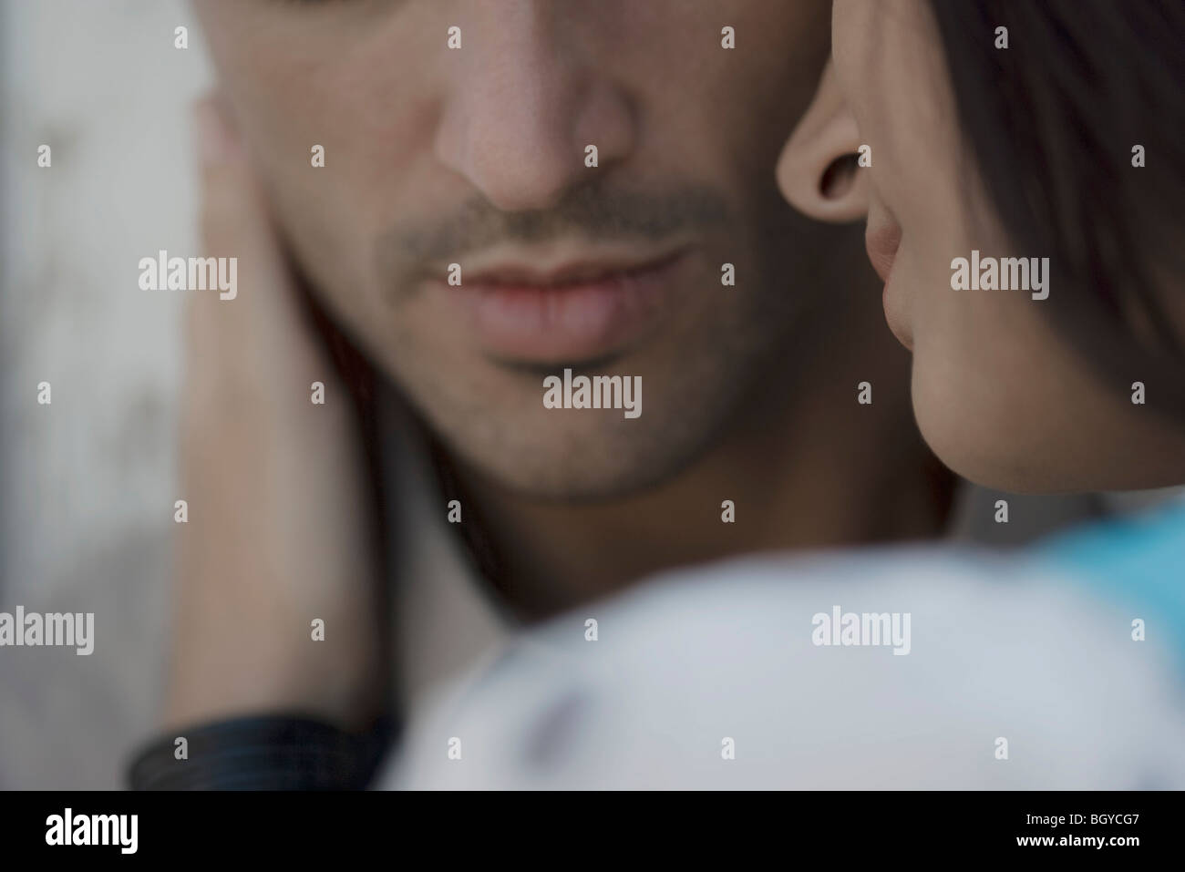 Couple close together, woman's hand caressing man's face Stock Photo ...