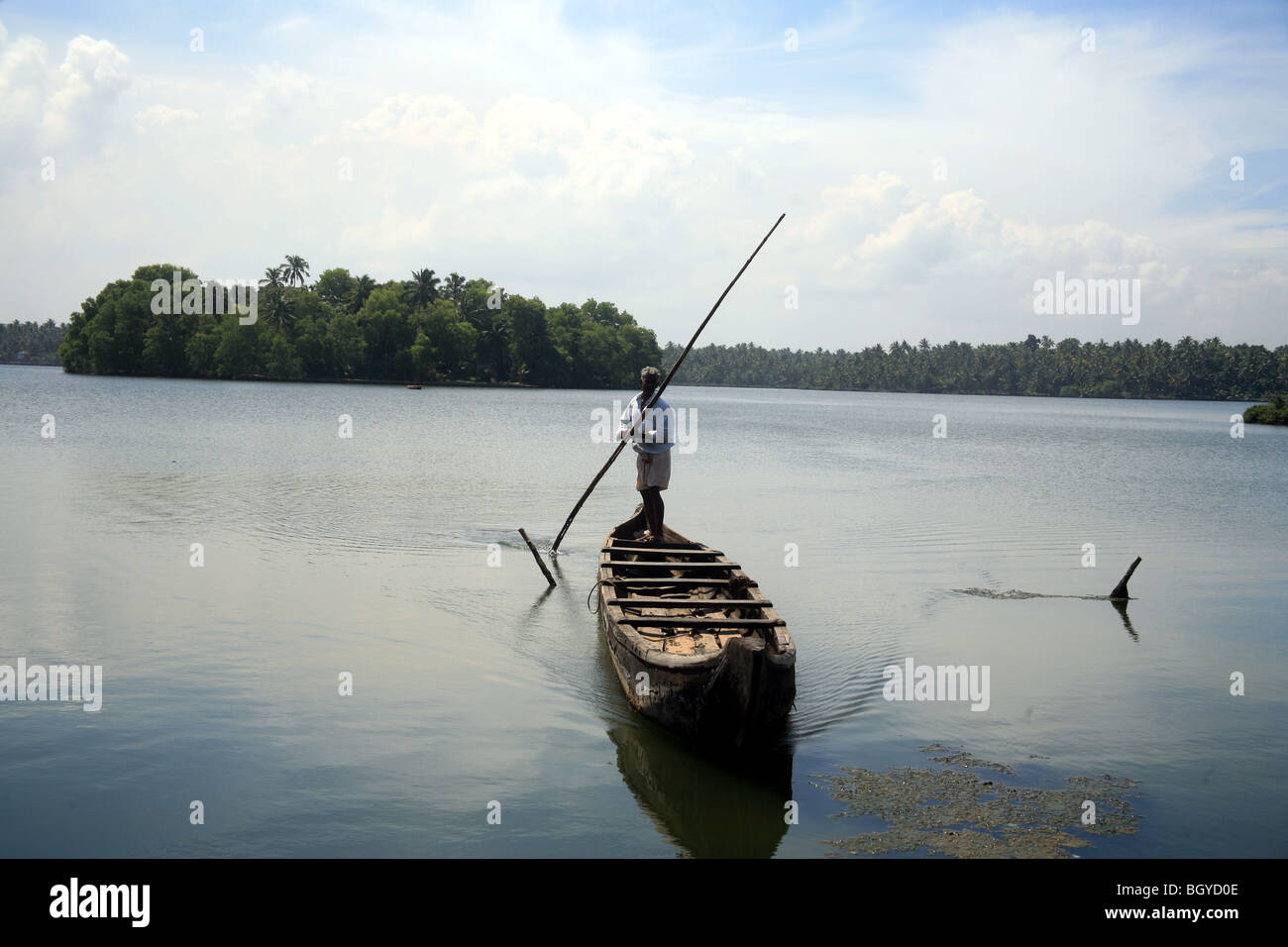 Wooden canoe taking visitors across lake to Ponnumthuruthu island ...