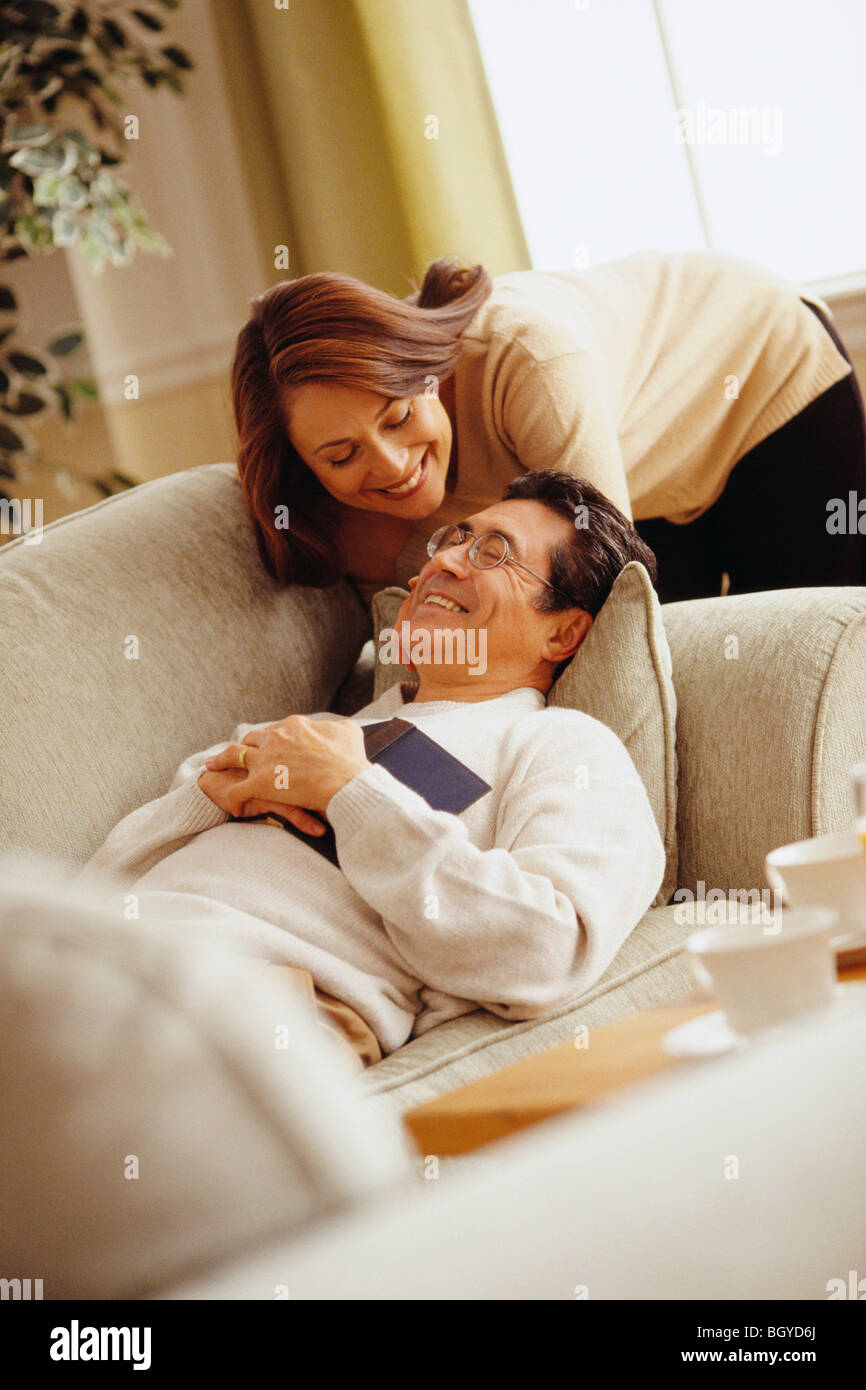 Happy couple in living room Stock Photo - Alamy