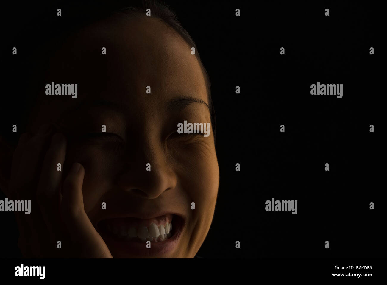 Woman laughing, eyes closed Stock Photo - Alamy