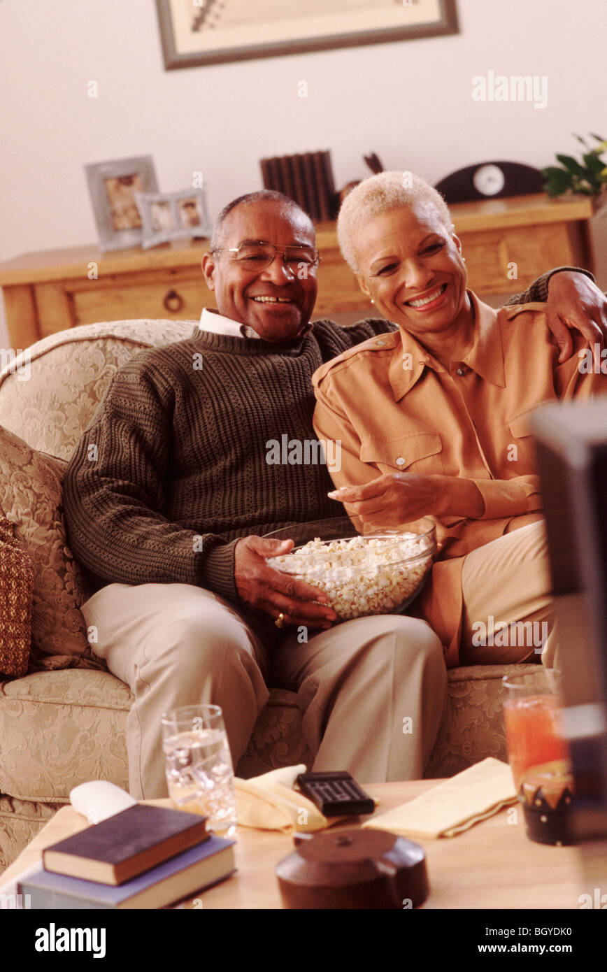 Woman reading book eating popcorn hi-res stock photography and images ...