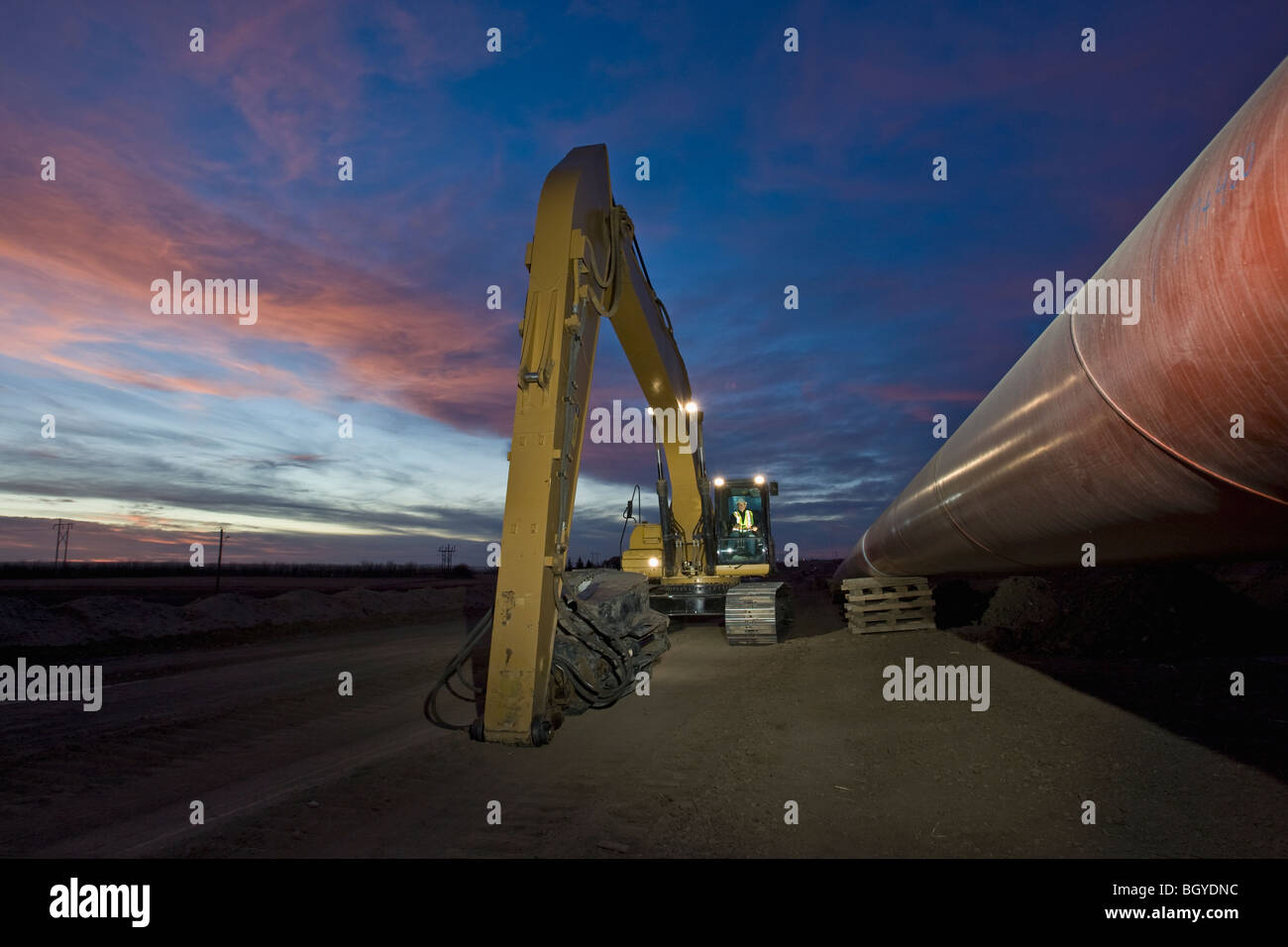 Heavy equipment beside pipeline Stock Photo - Alamy