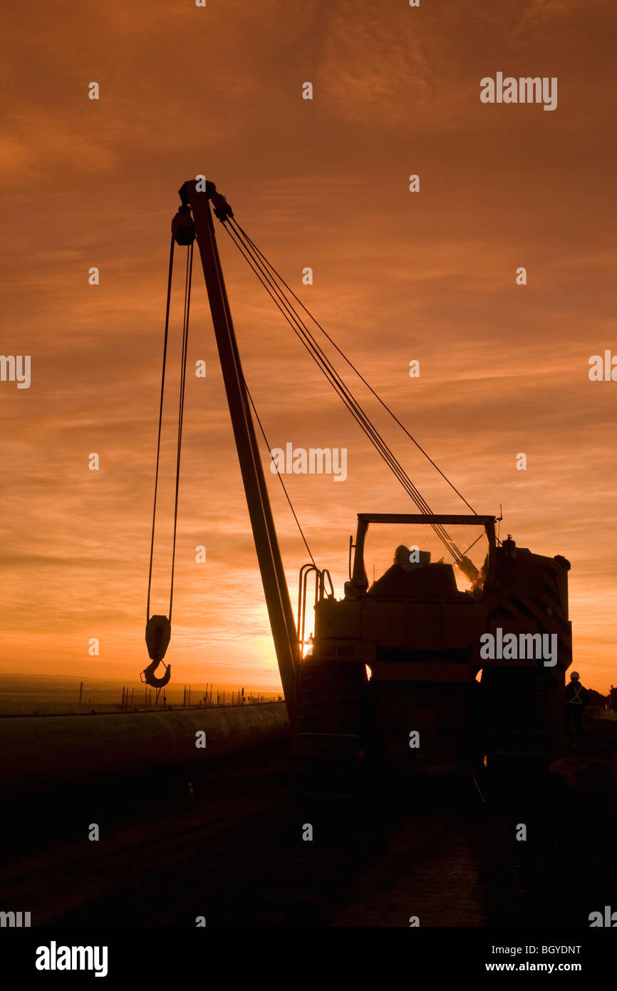 Heavy equipment at sunset Stock Photo - Alamy