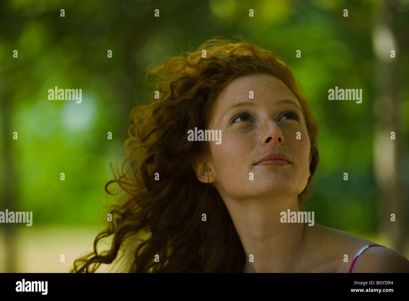 Young woman looking up, portrait Stock Photo - Alamy